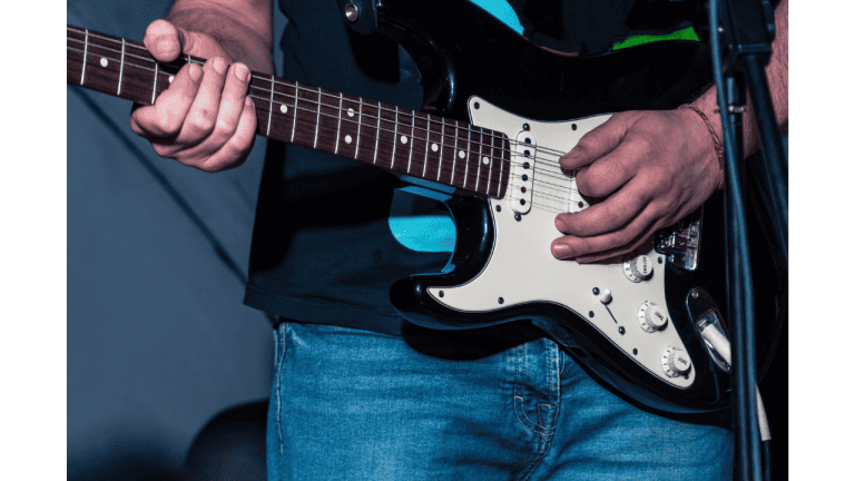 How to Hold a Guitar Left-Handed: A Beginner's Guide - Guitar Space